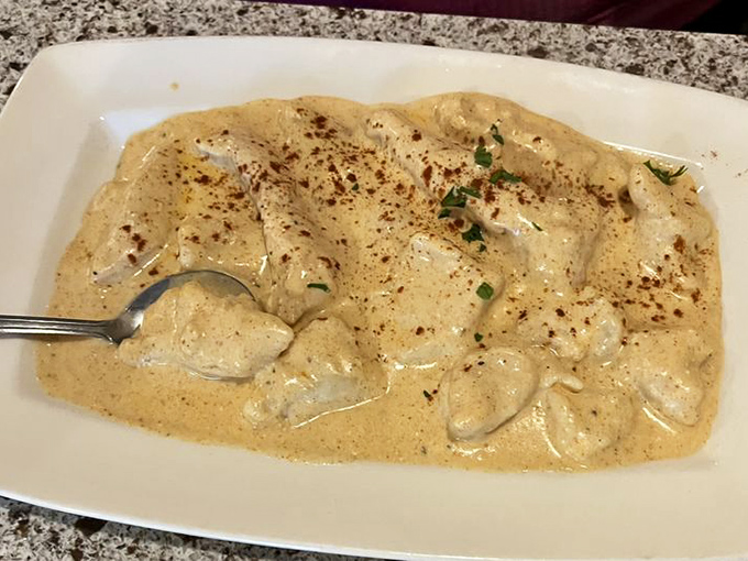 Behold the legendary chicken paprikash – tender chunks of chicken swimming in a creamy, paprika-infused sauce that would make any Hungarian grandmother nod in approval.