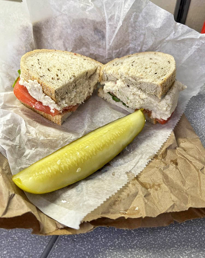 Simple perfection on seeded bread: this chicken salad sandwich with its crisp pickle spear is what lunch dreams are made of.