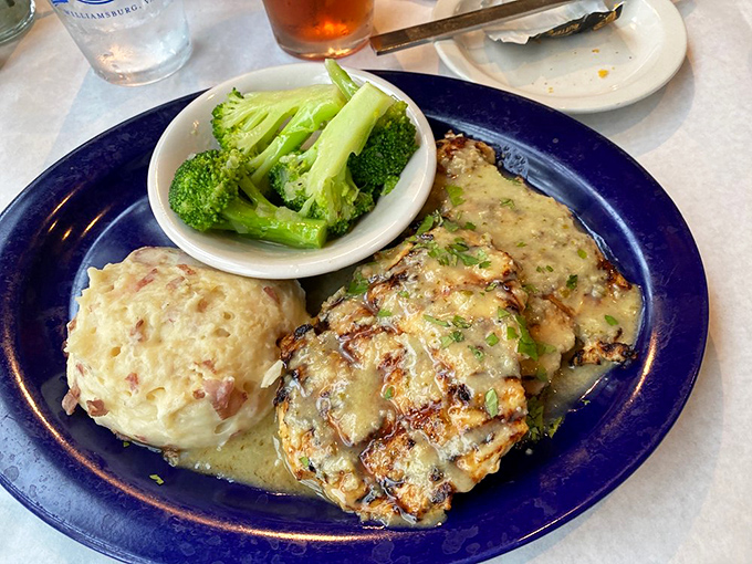 The legendary Cilantro Lime Chicken arrives like a revelation: perfectly grilled, cheese-draped, and accompanied by sides that refuse to be afterthoughts.