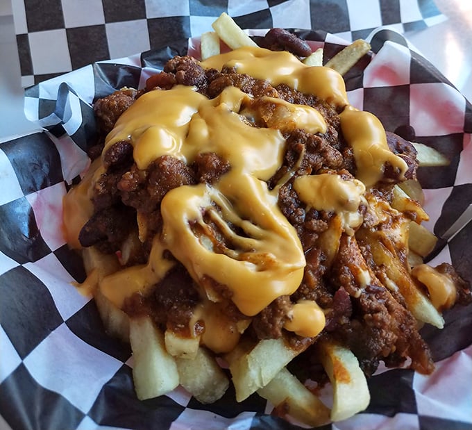 Behold the star attraction: chili cheese fries that could make a food critic weep with joy. A mountain of crispy potatoes, savory chili, and cheese that stretches like a Slinky.