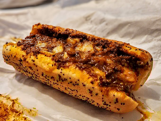 This isn't just a chili dog &ndash; it's a masterclass in balance, where savory meat sauce and melted cheese transform a simple hot dog into comfort food royalty.