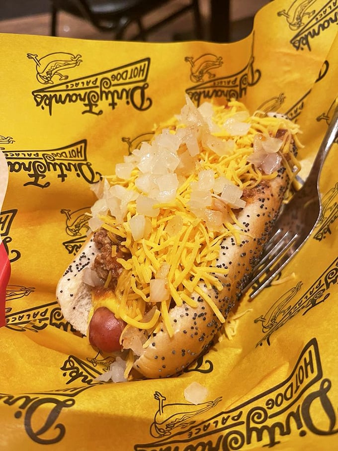 This isn't just a chili dog—it's a masterpiece of beef, cheese, and onions that demands to be photographed before devoured.