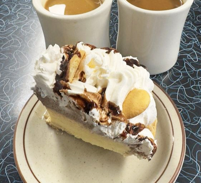 This isn't just dessert, it's therapy on a plate. Chocolate banana cream pie with whipped cream mountains that make everyday problems seem deliciously insignificant.