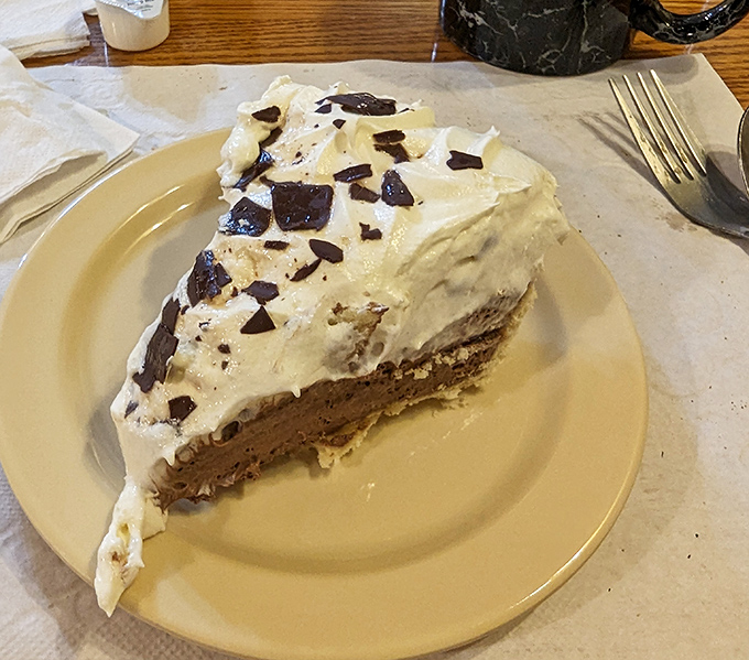 The chocolate cream pie in all its glory&mdash;a perfect stratification of crust, filling, and cloud-like topping that makes physicists question known laws of deliciousness.
