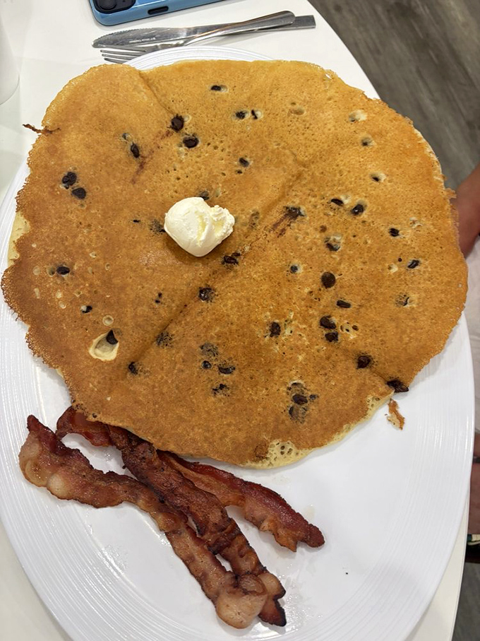 This blueberry pancake isn't just breakfast &ndash; it's a golden-brown canvas dotted with berry masterpieces. Michelangelo would approve.