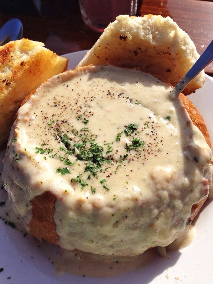 Behold, the crown jewel: their legendary clam chowder. This bread bowl isn't just a vessel; it's a sourdough throne for creamy, clam-studded royalty.