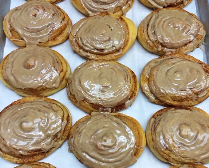 Cinnamon rolls that make you question every life decision that didn't involve eating these sooner. Golden spirals of joy topped with glaze that should be classified as a controlled substance.