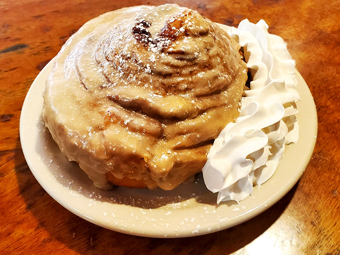 Behold the crown jewel &ndash; a cinnamon roll so magnificent it deserves its own zip code, complete with cream cheese icing waterfall.