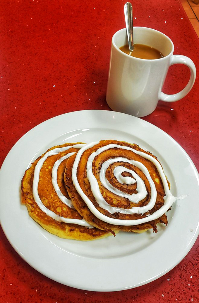 Cinnamon roll pancakes that make you question why regular pancakes even exist. That perfect spiral of icing is basically breakfast hypnosis.