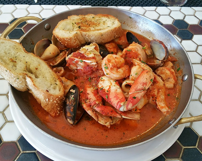 Cioppino that would make Neptune himself weep with joy &ndash; a tomato-based sea of treasures where every spoonful tells a different delicious story.
