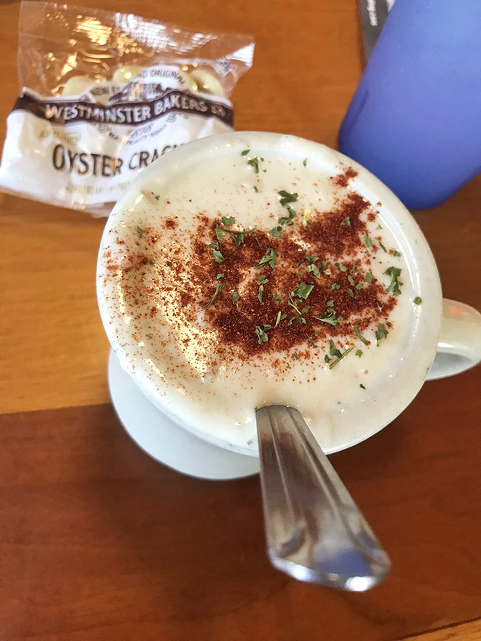 The legendary clam chowder arrives like a creamy cloud of seafood perfection, topped with a sprinkle of herbs that means business.