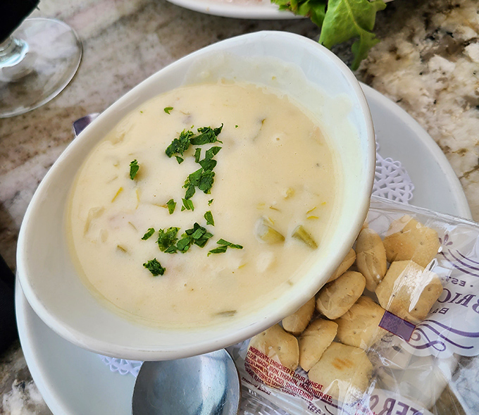 Creamy clam chowder that makes you question all other chowders in your life&mdash;sprinkled with fresh herbs and accompanied by oyster crackers for essential dipping.