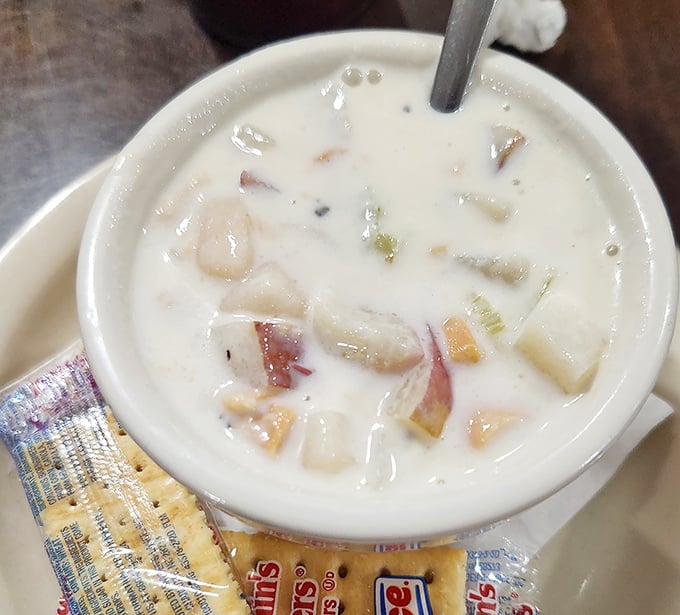 This isn't just clam chowder; it's a creamy bowl of maritime magic. Those tender clam pieces are practically doing the backstroke in buttery bliss.