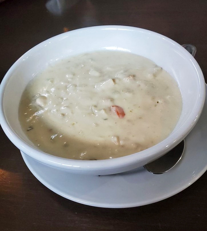 The legendary clam chowder in all its creamy glory &ndash; where each spoonful is like a warm hug from the ocean itself.