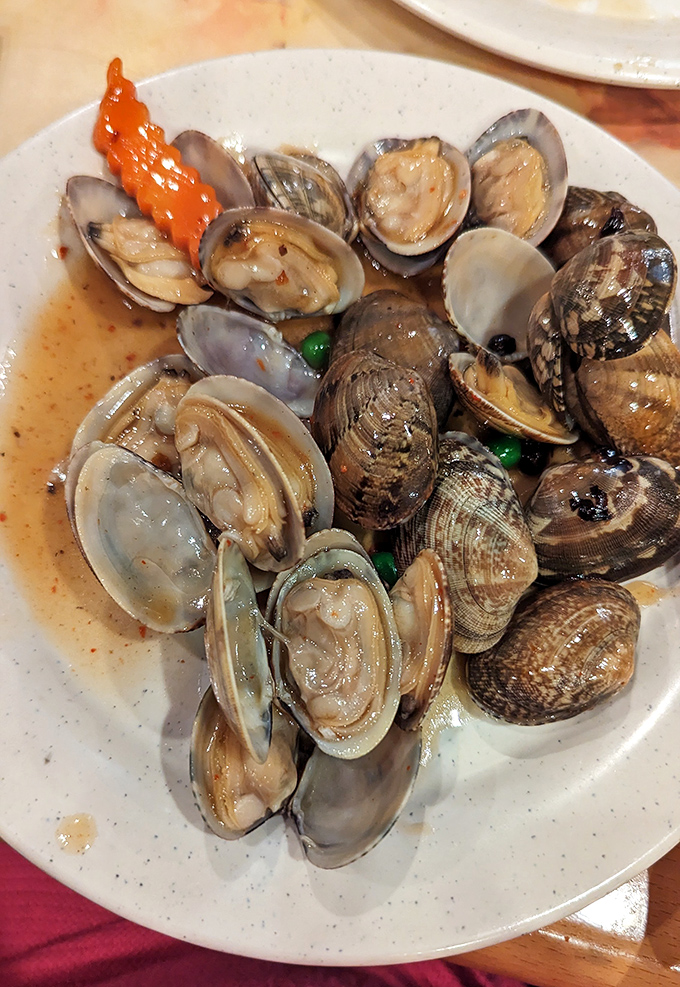 These clams aren't just cooked, they're transformed&mdash;plump, tender morsels bathed in a savory broth that demands to be sopped up with anything available.