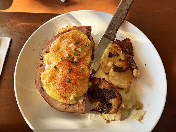 Eggs Benedict perfection! That hollandaise sauce glistening atop perfectly poached eggs would make Julia Child do a happy dance.