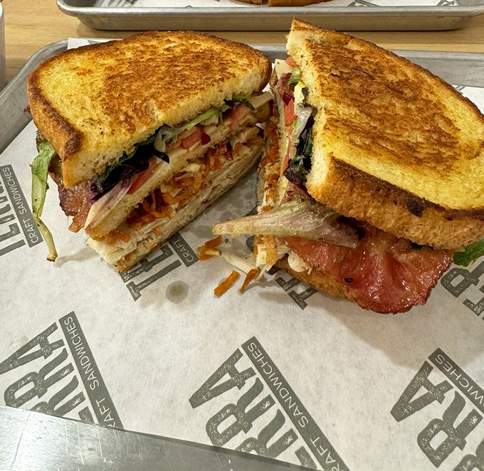 This club sandwich isn't just stacked &ndash; it's architected. The golden toast practically winks at you, saying "you made the right choice."