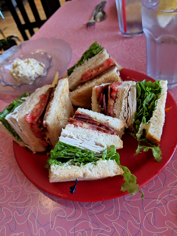 The legendary club sandwich in all its triple-decker glory. Architectural perfection where bread, meat, and veggies achieve harmonious balance.