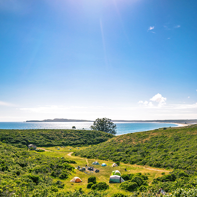 Camping with a million-dollar view, minus the million-dollar price tag. Coast Campground's seaside tents offer the ultimate room with a view.
