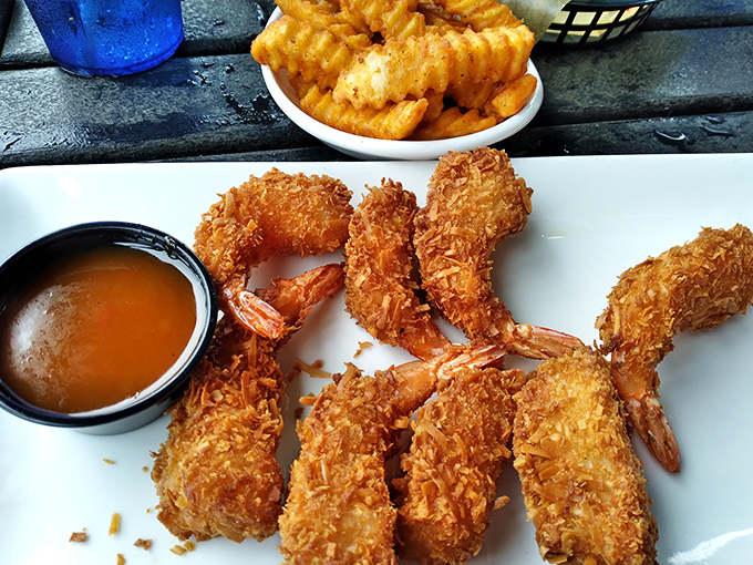 Golden-armored shrimp that crunch like autumn leaves. The coconut crust creates the perfect textural contrast to the tender seafood hiding within.