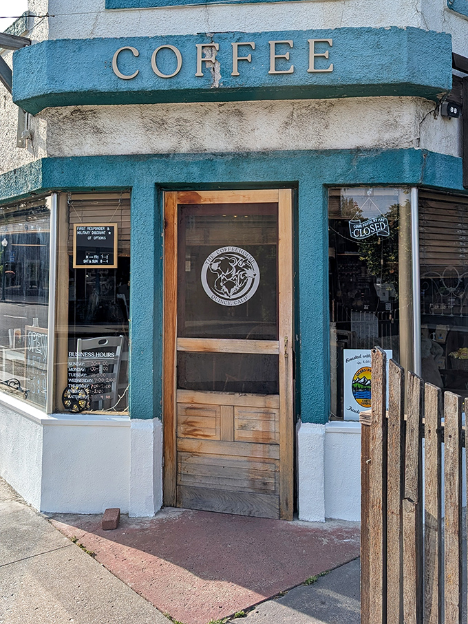 This little blue coffee shop corner promises the kind of caffeine experience where baristas remember your name and your life story by your third visit.