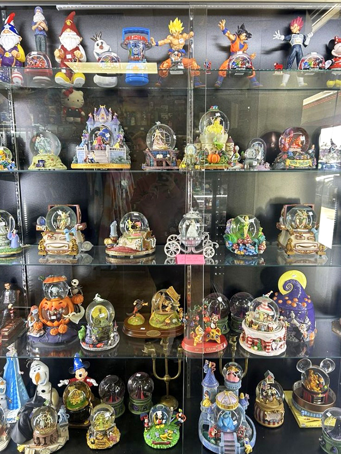 A treasure trove of Disney snow globes and figurines &ndash; each one a tiny universe of nostalgia waiting to be shaken.