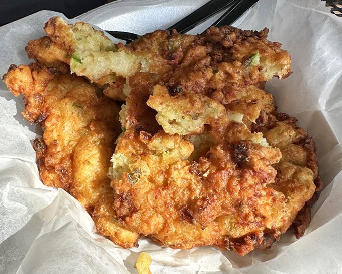 Golden orbs of pure happiness arrive still crackling, each bite delivering chunks of sweet conch in perfect cornmeal armor.