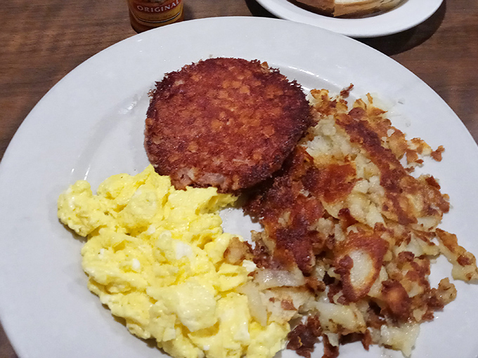 This is what breakfast dreams are made of&mdash;golden hash browns with that perfect crisp, fluffy scrambled eggs, and a sausage patty with just the right char.