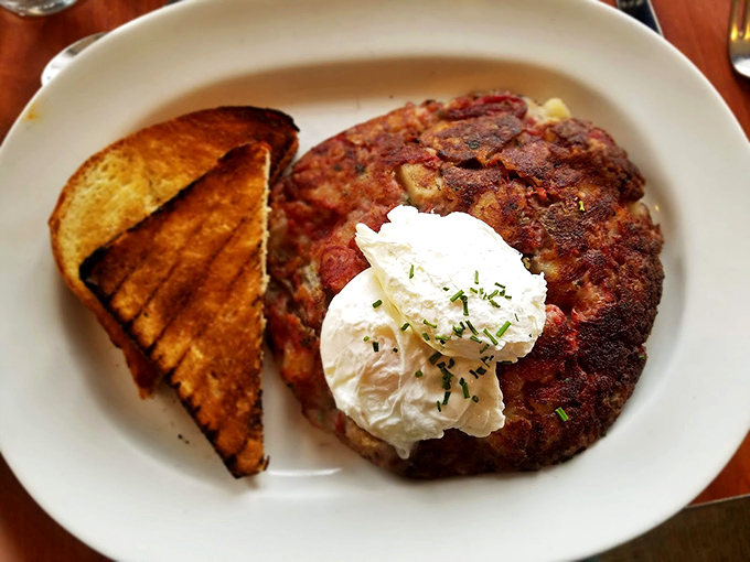The holy grail of breakfast &ndash; corned beef hash with a dollop of heaven on top. This isn't just breakfast; it's an edible love letter to morning.