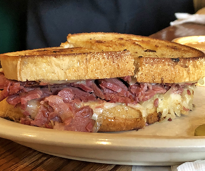 The legendary Reuben in all its glory&mdash;corned beef stacked higher than your weekend to-do list, with sauerkraut and Swiss creating the perfect savory symphony.