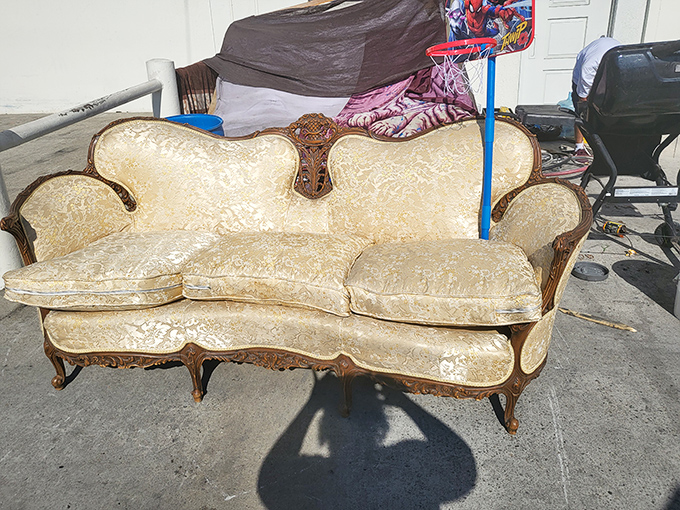 This vintage sofa has seen some stories. With the right TLC, it could become the conversation piece your living room's been missing.
