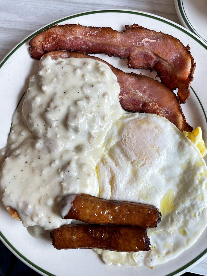 Biscuits and gravy with eggs and bacon—the breakfast equivalent of a warm hug from your favorite aunt who knows comfort food is the best therapy.