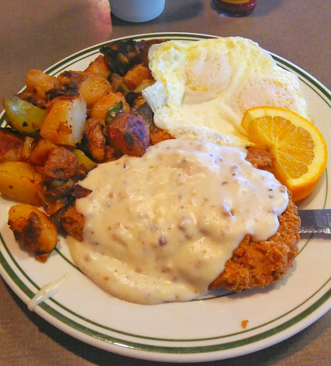 Country fried steak that deserves its own zip code &ndash; crispy exterior, tender meat, and gravy that would make your grandmother both jealous and proud.