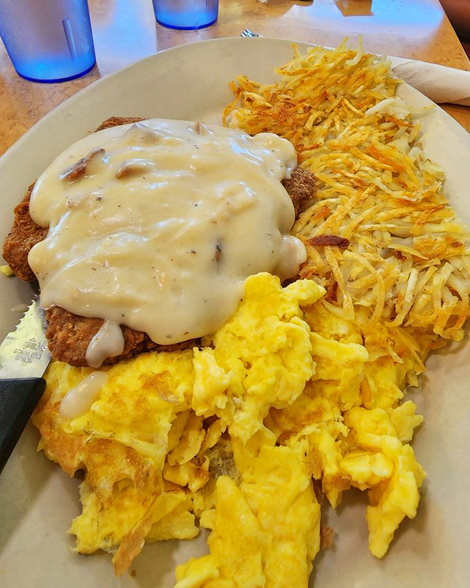 Country fried steak that could make a vegetarian weep, smothered in gravy that deserves its own fan club.