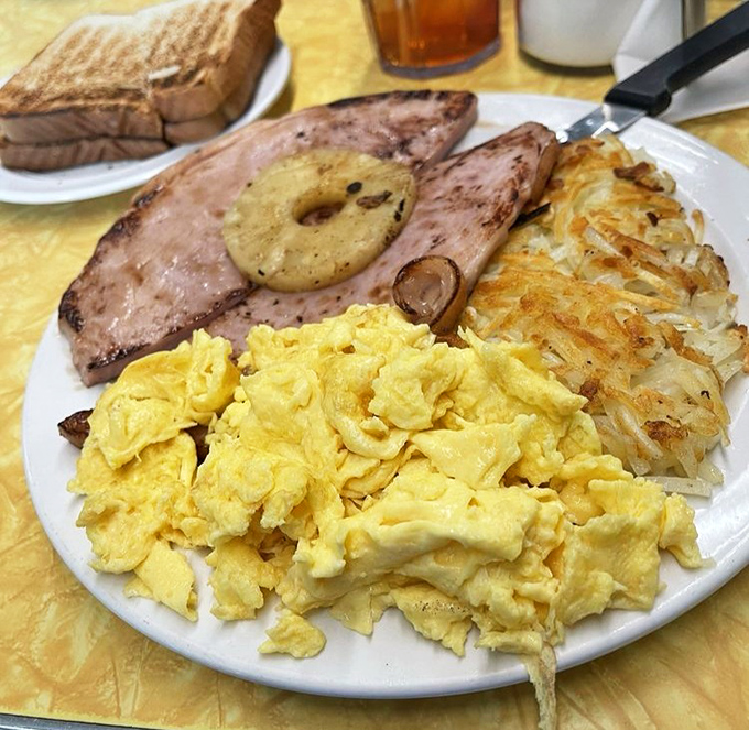 Breakfast architecture at its finest&mdash;golden hash browns, fluffy scrambled eggs, and ham with a perfect sear that would make your grandpa proud.