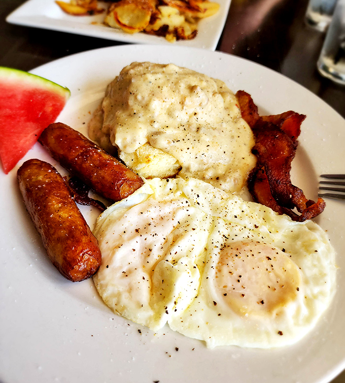 Country breakfast done right: eggs, bacon, sausage, and enough comfort to cure any morning blues.