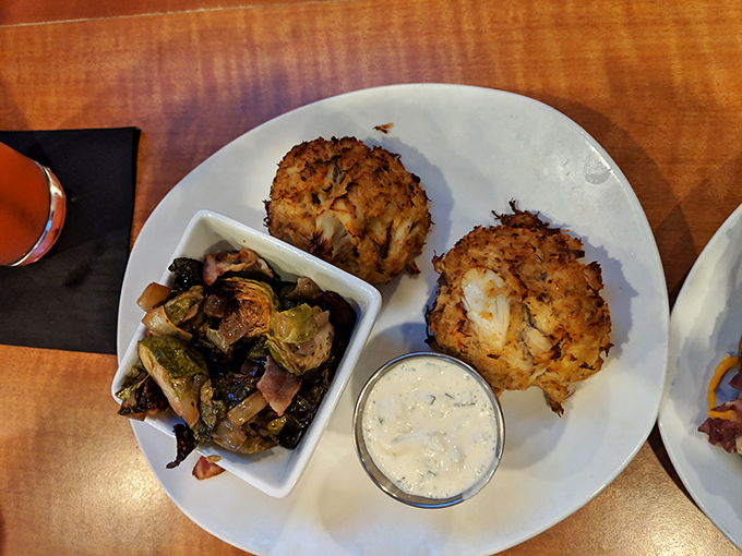 These golden-brown crab cakes aren't just appetizers, they're an event &ndash; packed with sweet lump meat and served with a side of culinary revelation. 