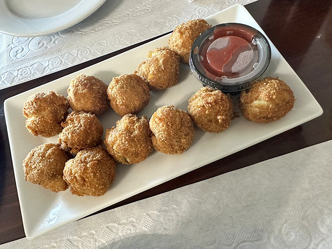 These golden-brown crab balls are the reason people drive for hours. Crispy exterior, tender crab-packed interior&mdash;seafood perfection in bite-sized form.