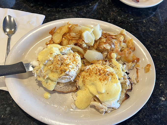 The legendary Crab Benedict in all its glory. Two perfectly poached eggs atop mountains of real lump crabmeat&mdash;this breakfast masterpiece might just ruin all other morning meals forever.