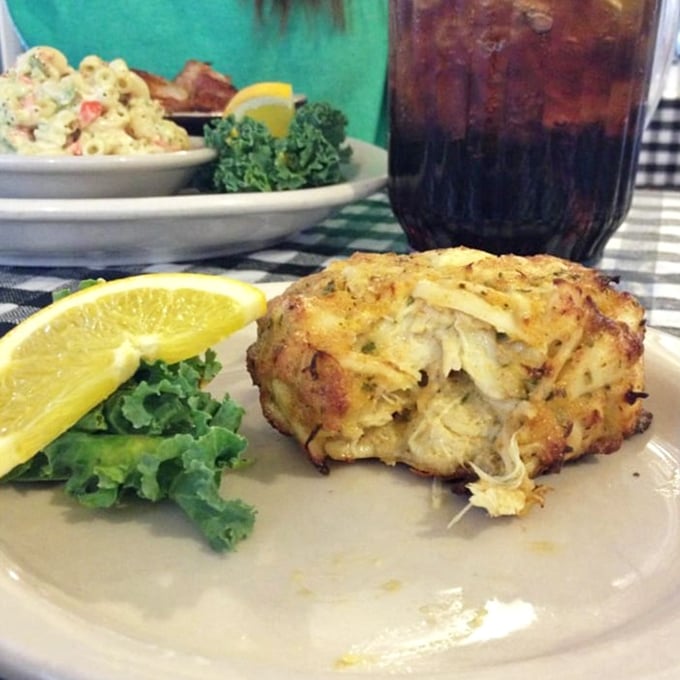 This golden-brown crab cake isn't playing hard to get – it's practically winking at you with chunks of sweet meat that barely need binding to stay together.
