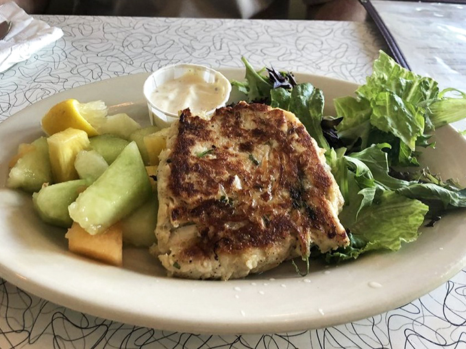 Golden-brown perfection on a plate&mdash;this crab cake isn't playing games. All crab, minimal filler, and a reminder of why we fell in love with seafood in the first place.