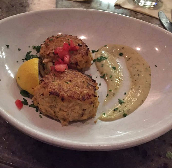 Two golden-brown crab cakes that could make Maryland jealous, with just enough crisp exterior to contain what can only be described as crab heaven. 