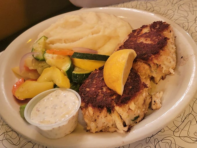 Golden-brown perfection on a plate! These crab cakes are what seafood dreams are made of&mdash;minimal filler, maximum flavor, and a side of Florida sunshine.