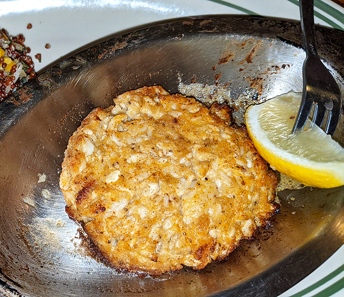 Golden-brown perfection on a plate. This crab cake isn't playing games&mdash;it's all about the sweet lump crabmeat with minimal filler and maximum flavor.