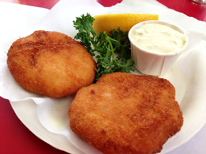 Golden-brown perfection that would make Neptune himself swim ashore. These crab cakes deliver what so many others merely promise &ndash; actual crab, gloriously unobscured by filler.