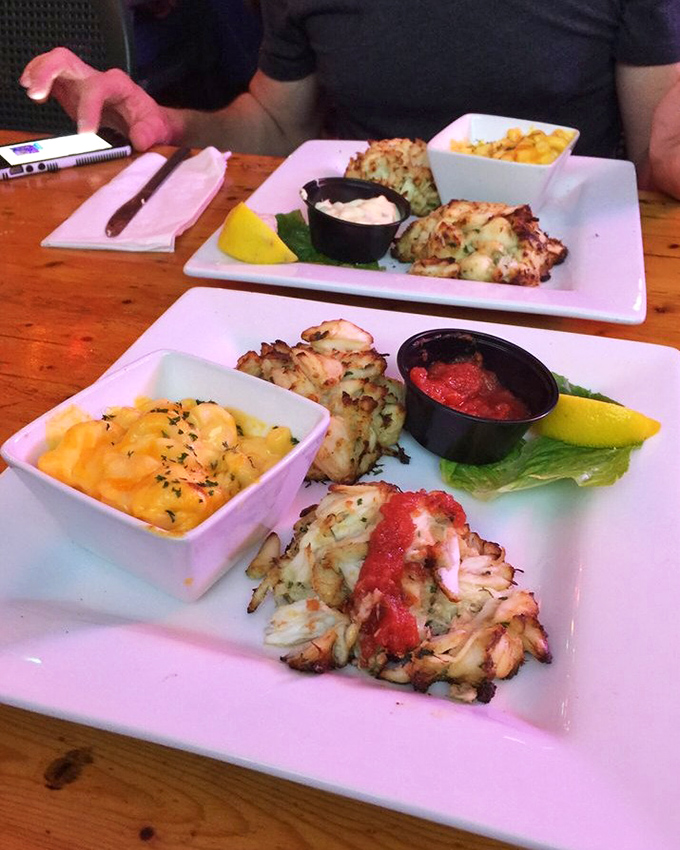 Not all heroes wear capes&mdash;some come on white plates with mac and cheese, perfectly golden exteriors hiding treasures of sweet jumbo lump crab.