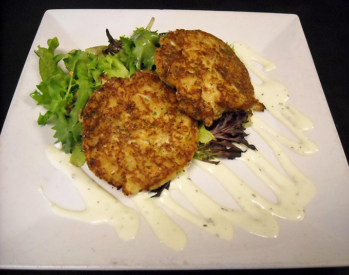 Golden-brown crab cakes that could make Maryland jealous, served with a delicate sauce that doesn't dare compete with the star of the show.