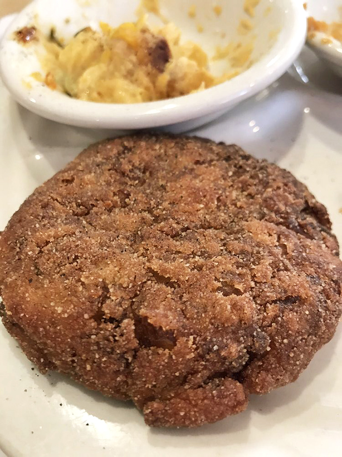 The star of the show: a perfectly golden crab cake that's more crab than cake. This is what seafood dreams are made of.