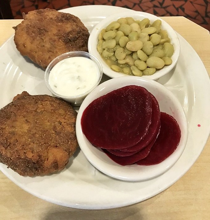 These crab cakes aren't playing games &ndash; just pure, lump crab meat with minimal filler, served alongside lima beans and beets for a Southern touch.
