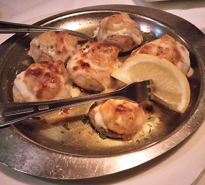 These aren't just mushrooms &ndash; they're little boats of happiness sailing on a sea of buttery goodness, carrying precious crab cargo to your taste buds.